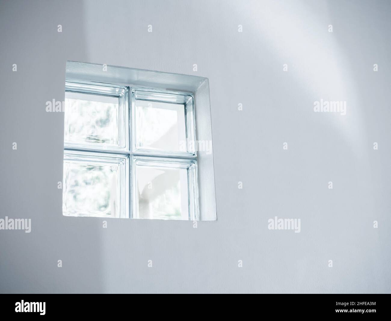 Close up four glass blocks, window bricks, lighted channel for the ...