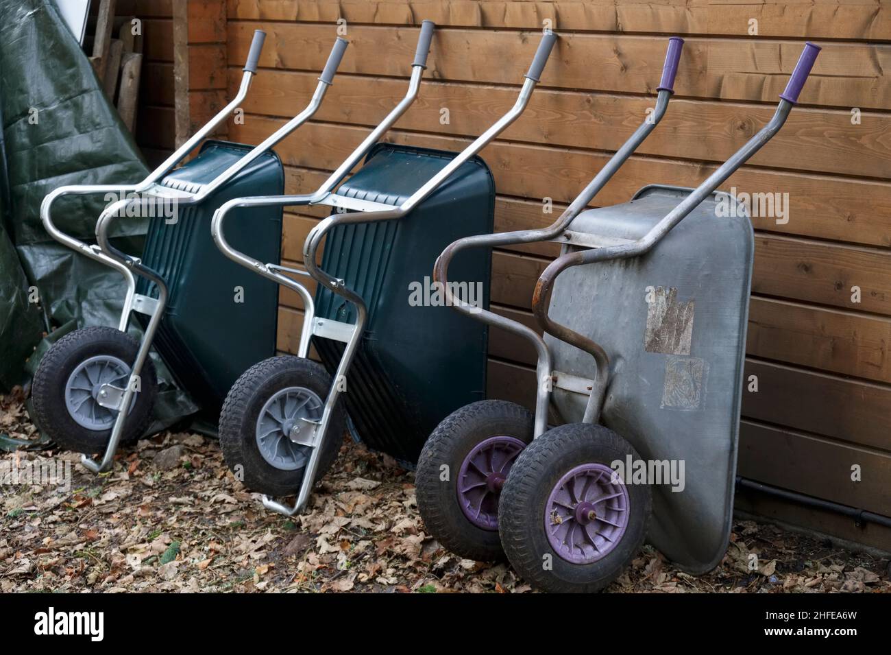 Gardening equipment and wheelbarrow in yard garden Stock Photo - Alamy