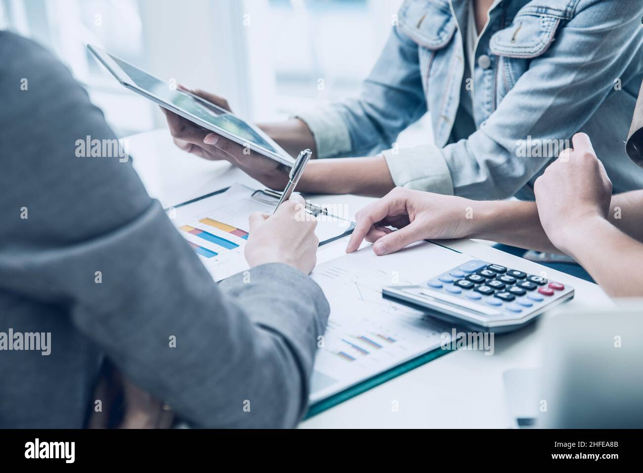 Colleagues working together office report hi-res stock photography and ...