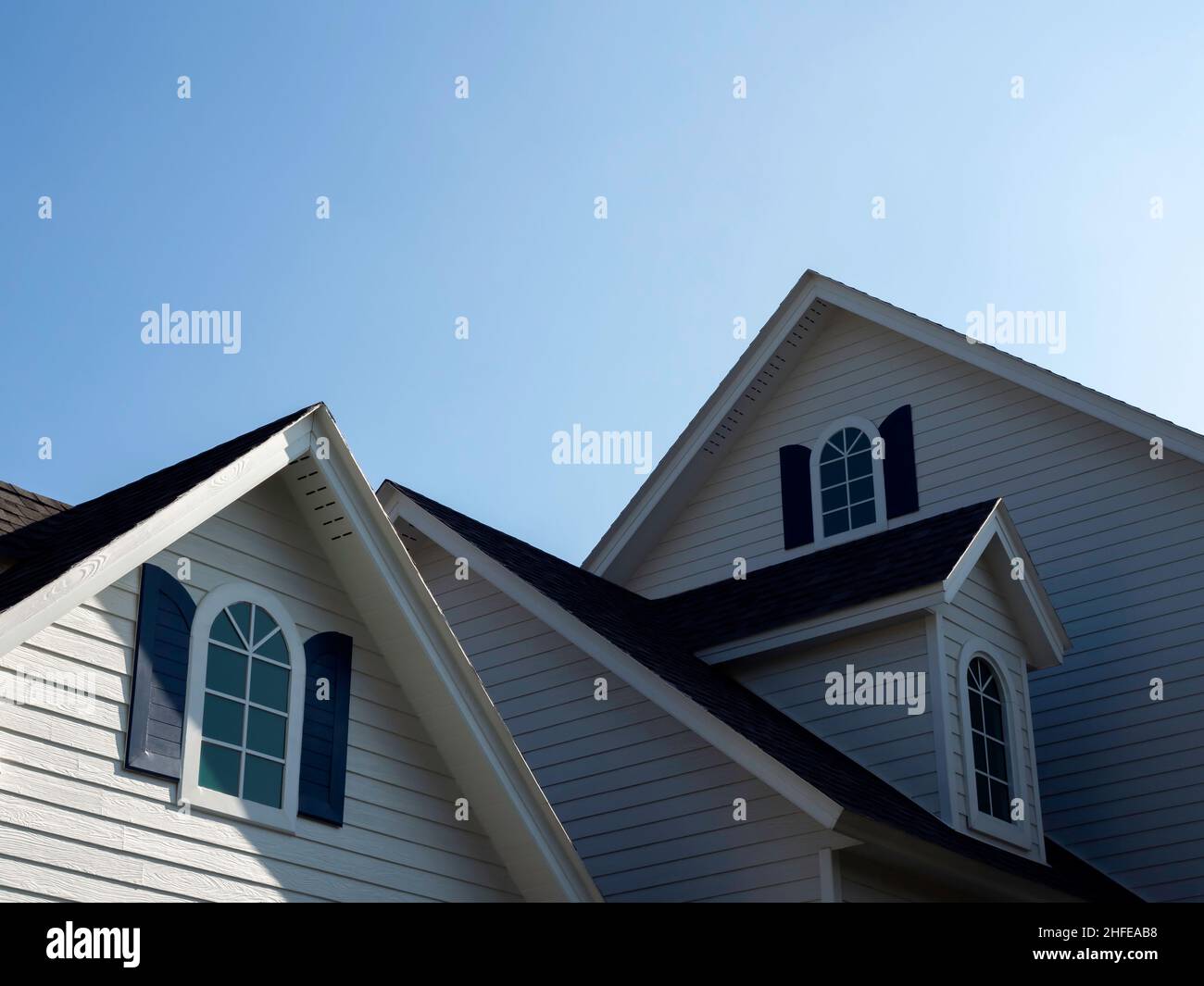 White vintage curved frame windows, little room decoration on the roof ...