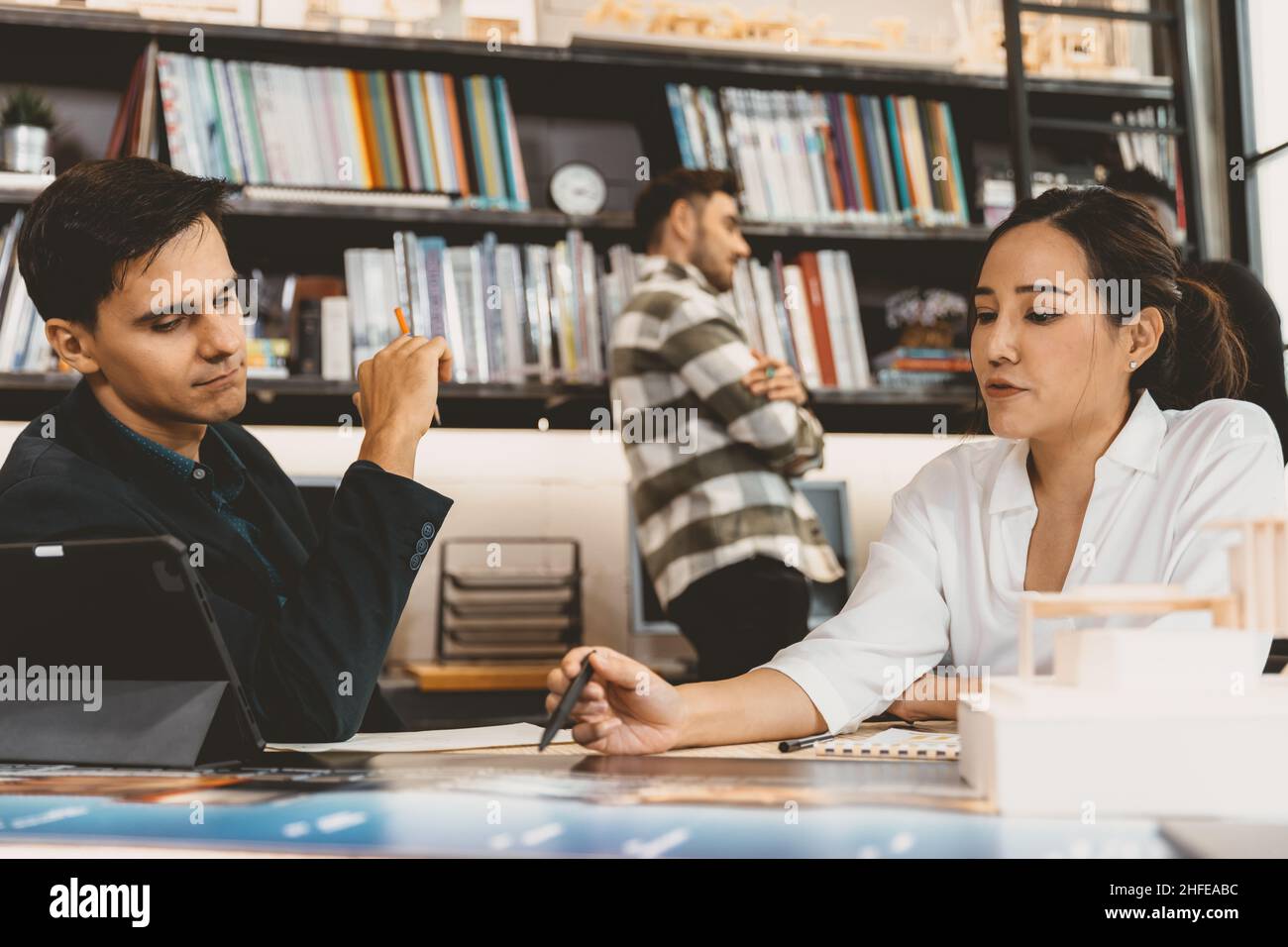 Working woman work with male business team for project discussion in ...