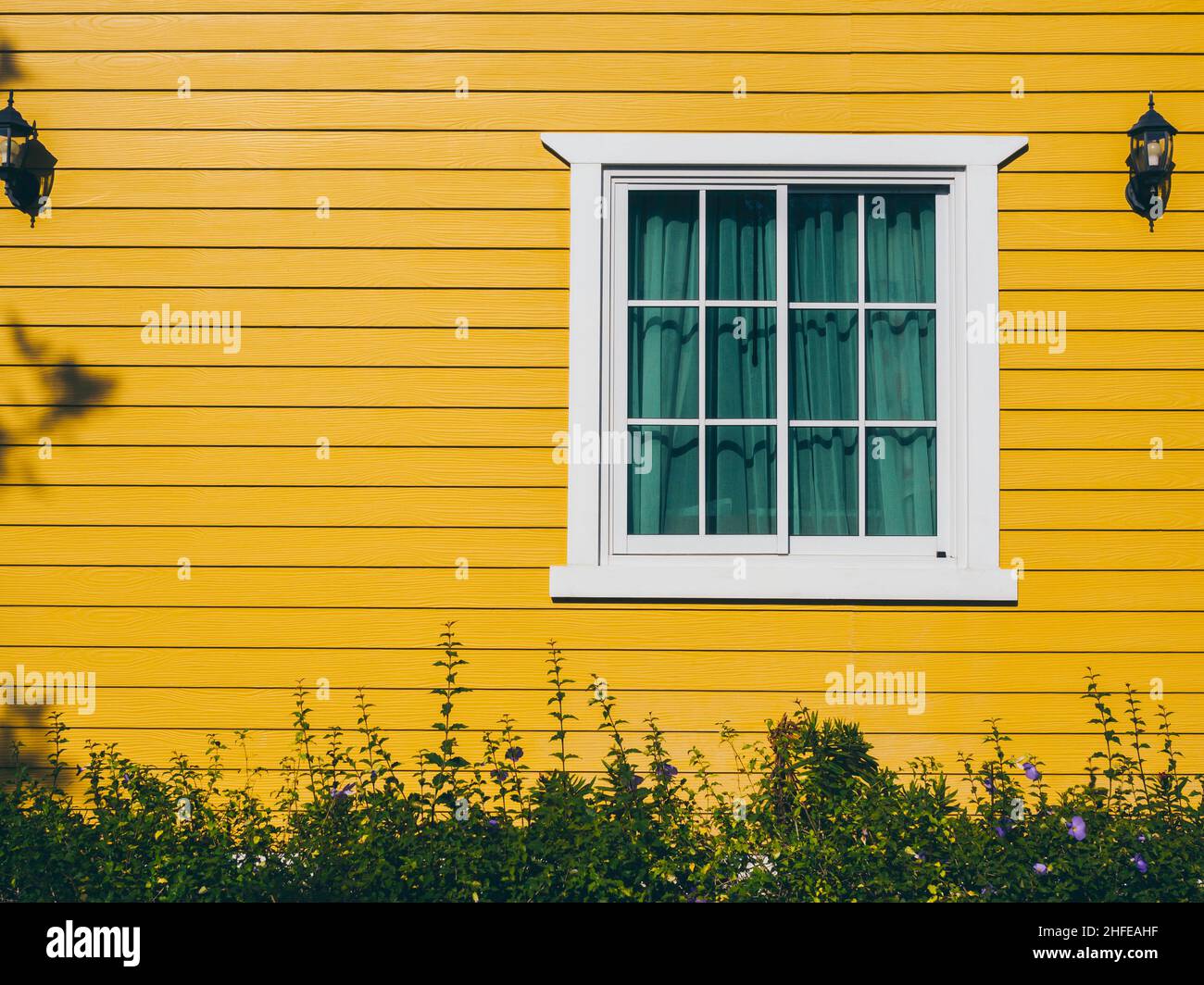 A white house window with glass, green curtain decoration with wall ...
