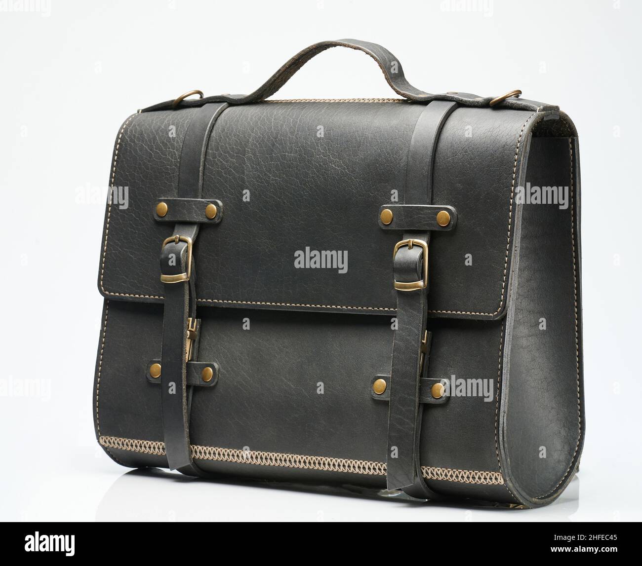 Side view of black leather briefcase isolated on white studio ...