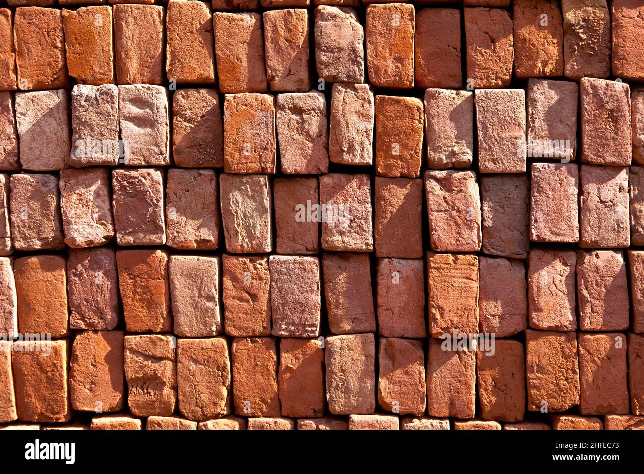 red stapled bricks give a harmonic pattern in the sun Stock Photo - Alamy