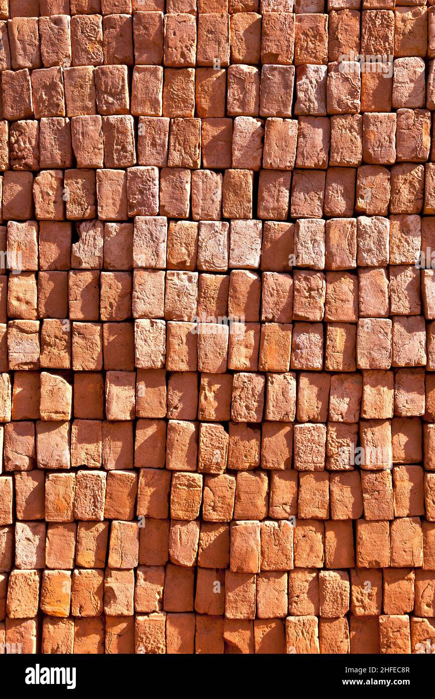 red stapled bricks give a harmonic pattern in the sun Stock Photo - Alamy
