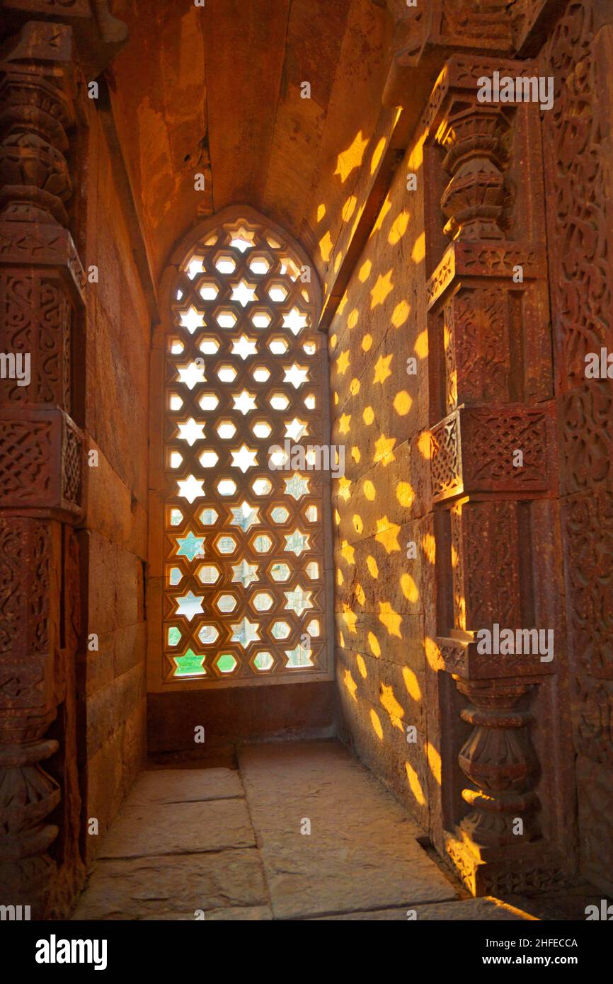 Qutb Minar, Delhi, carvings in the sandstone of a window gives a ...