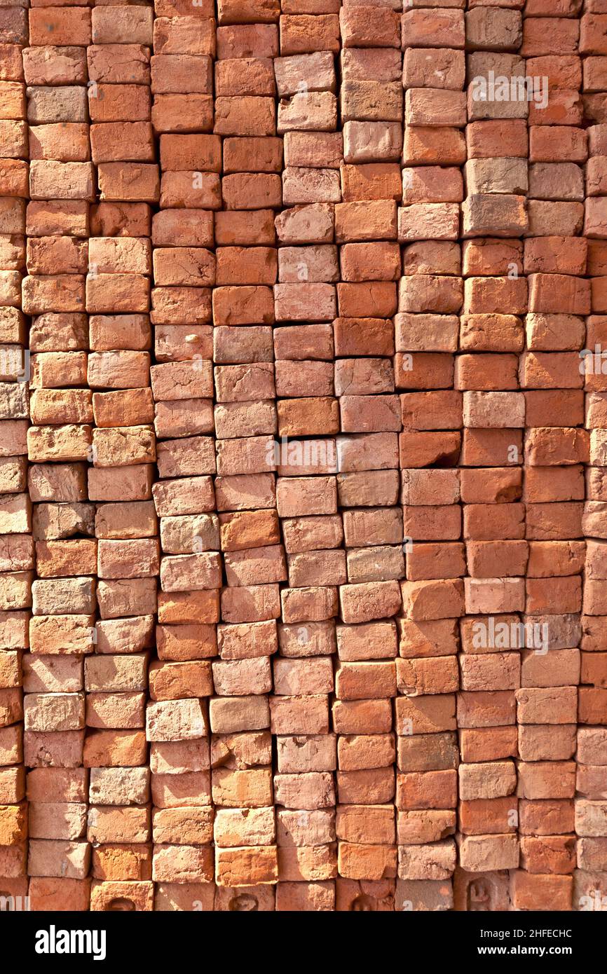 red stapled bricks give a harmonic pattern in the sun Stock Photo - Alamy