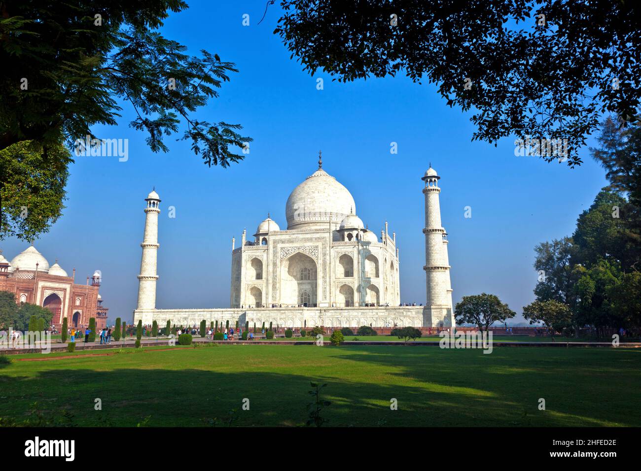 Taj Mahal in India in backlight seen from the arch of the mosque in ...