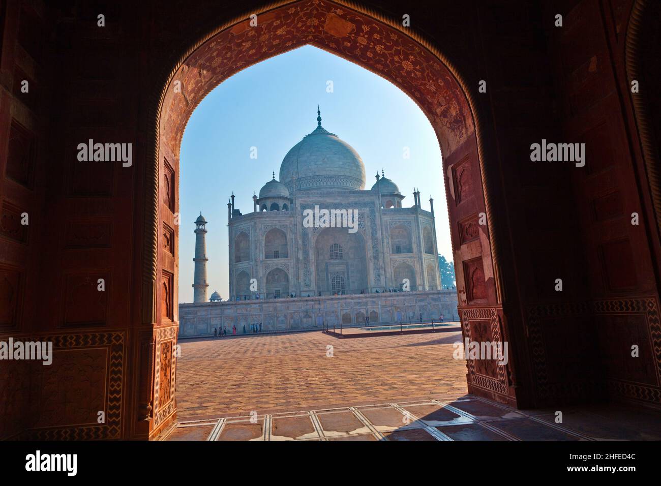 Taj Mahal in India in backlight seen from the arch of the mosque in ...