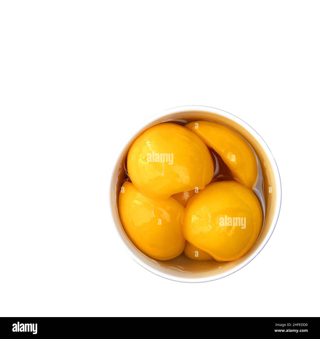 Delicious peaches in syrup in a bowl on white background Stock Photo ...