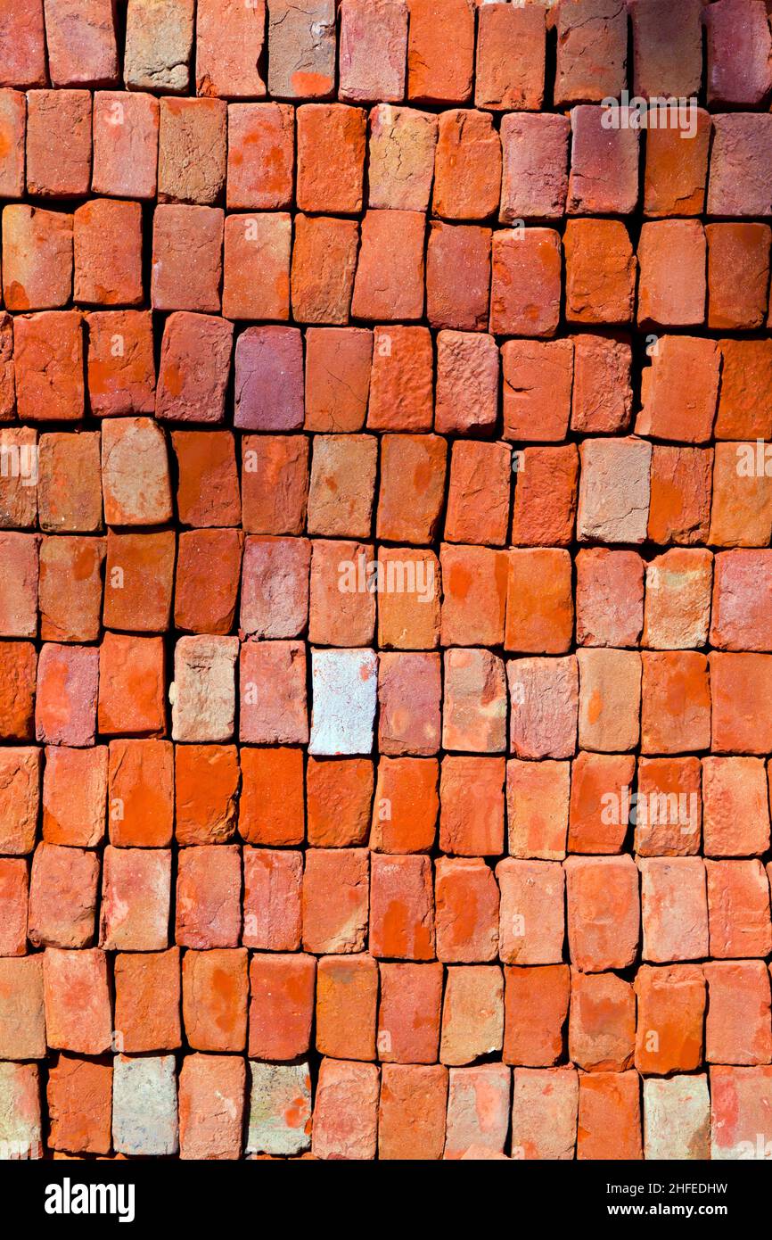 red stapled bricks give a harmonic pattern in the sun Stock Photo - Alamy