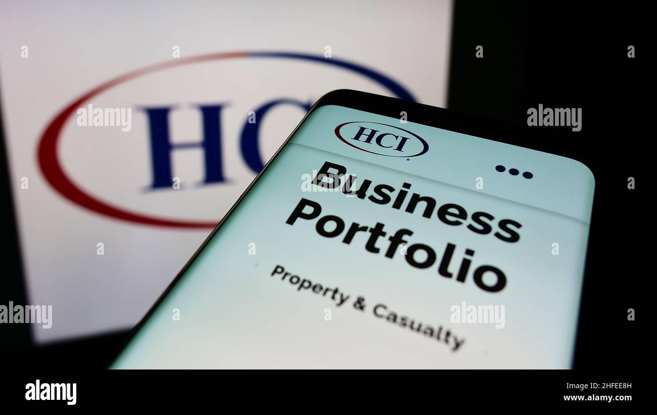 Mobile phone with webpage of US insurance company HCI Group Inc. on ...