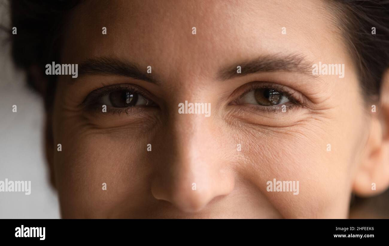 Smiling millennial female client feeling satisfied with eyesight laser ...