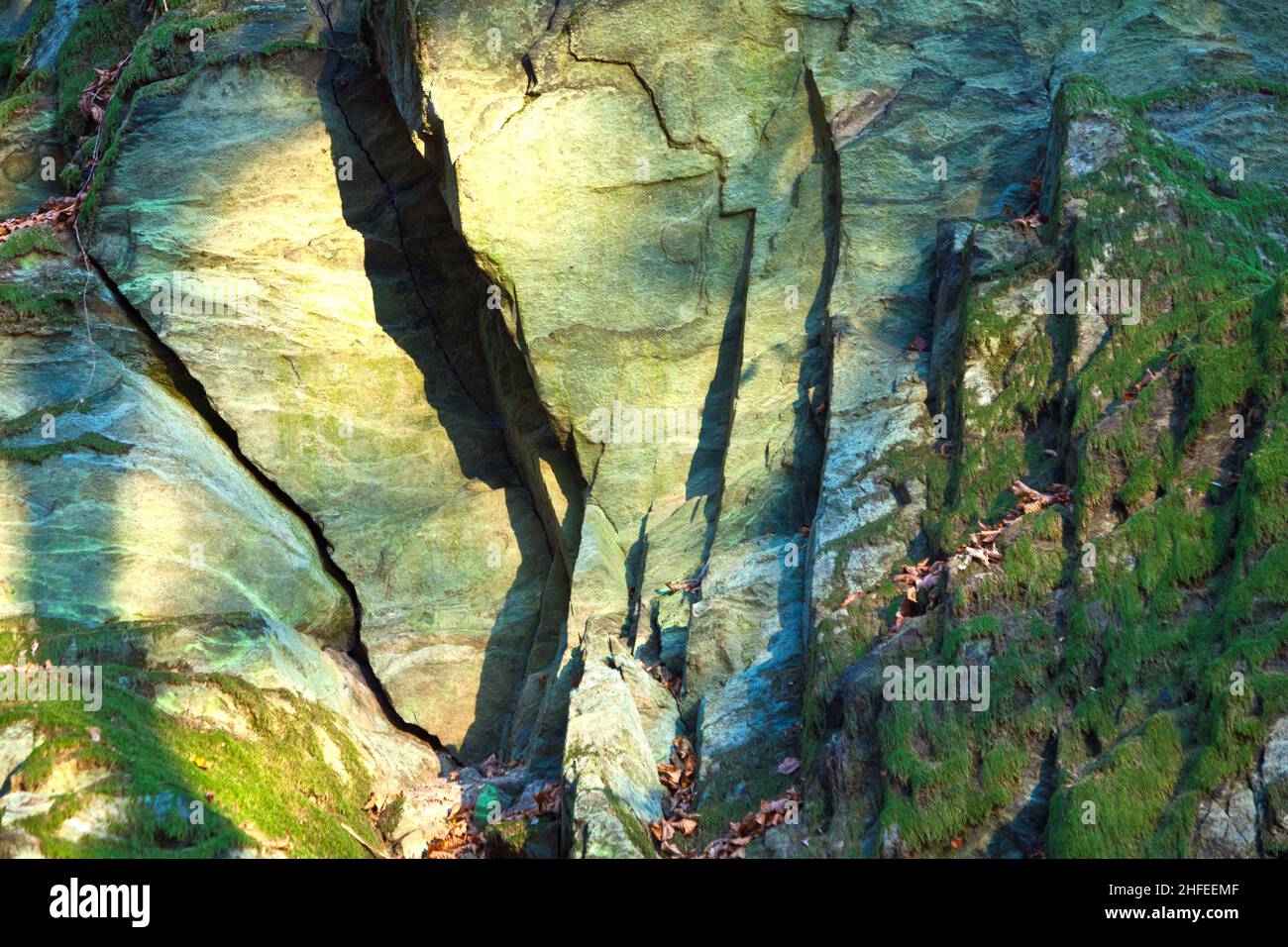stone structure of rock with green moss Stock Photo - Alamy