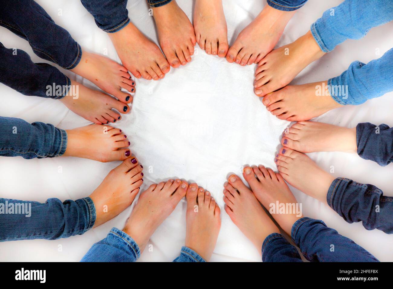 feet of girls form a circle Stock Photo - Alamy
