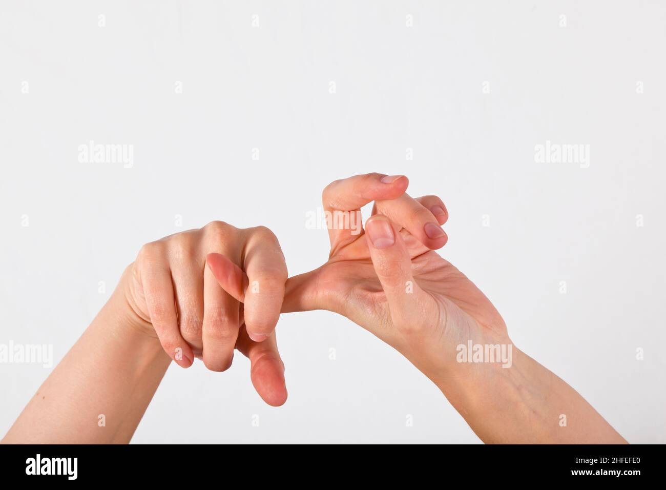 A womans hand is shown in yoga gesture Stock Photo - Alamy