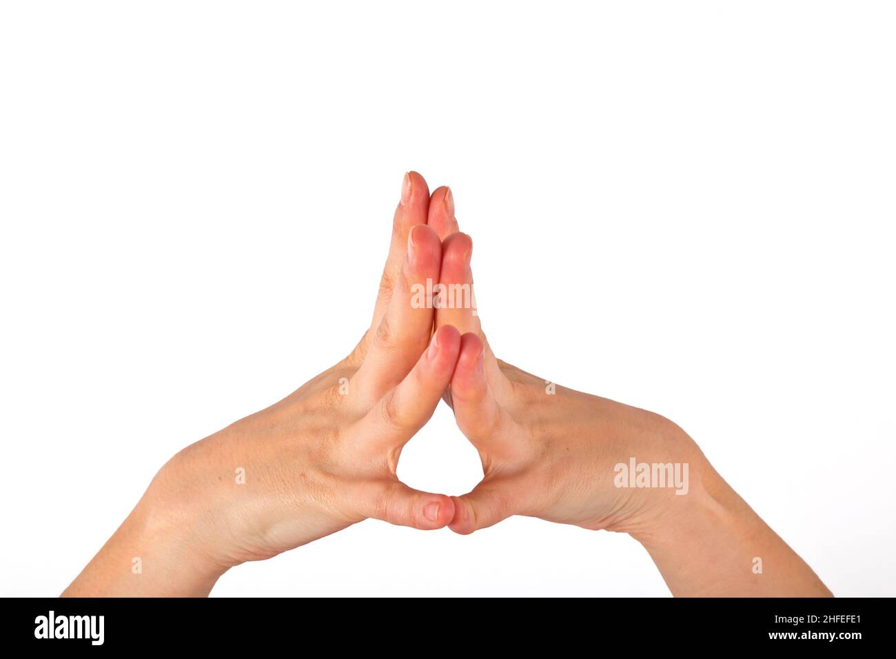 A womans hand is shown in yoga gesture Stock Photo - Alamy