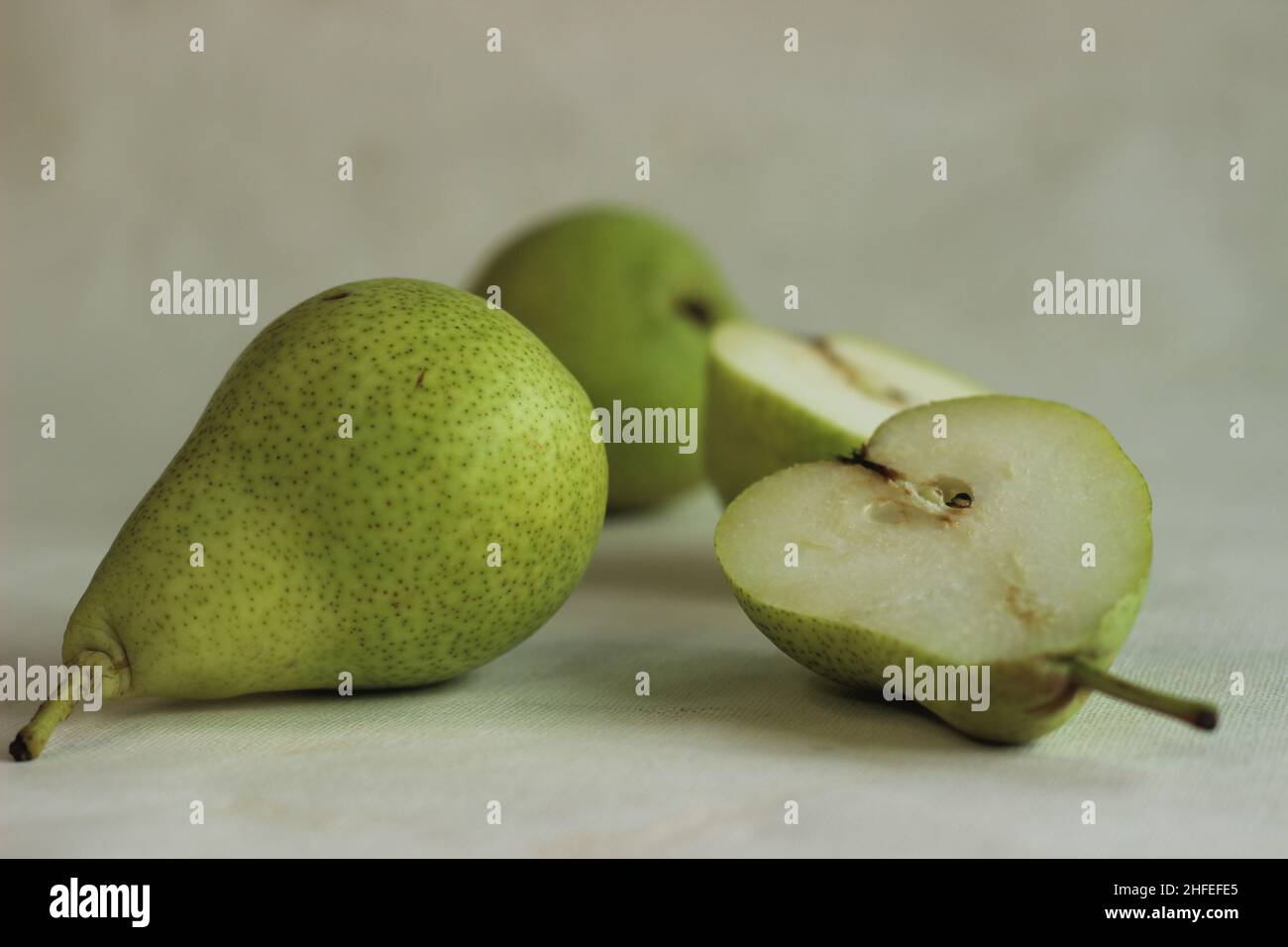 Juicy flavourful green colour pears along with cut slices . isolated ...
