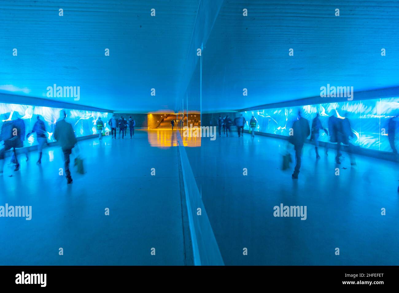 tunnel with pedestrians in motion in blue cool light Stock Photo - Alamy