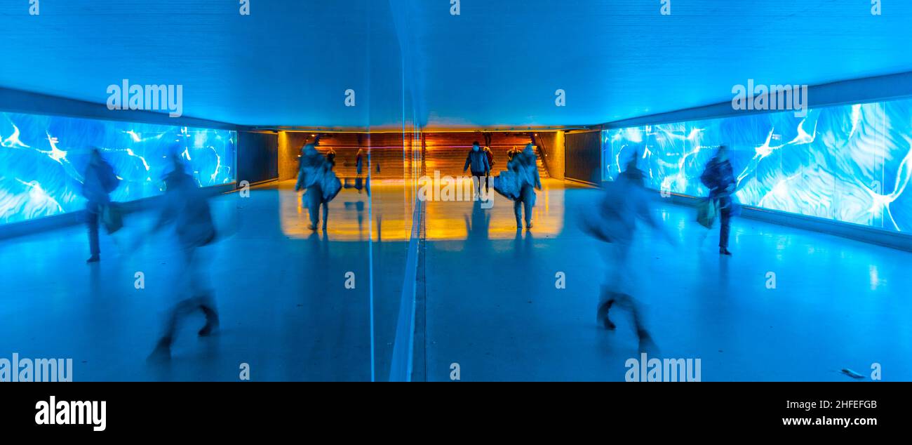 tunnel with pedestrians in motion in blue cool light Stock Photo - Alamy