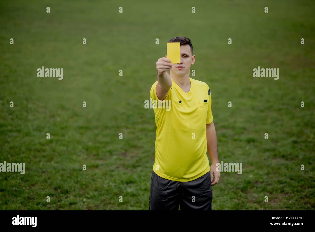 Referee showing a red card to a displeased football or soccer player ...