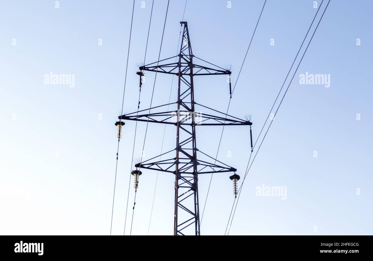 High voltage power lines, post or tower against the backdrop of a beautiful sky. Sequentially ...