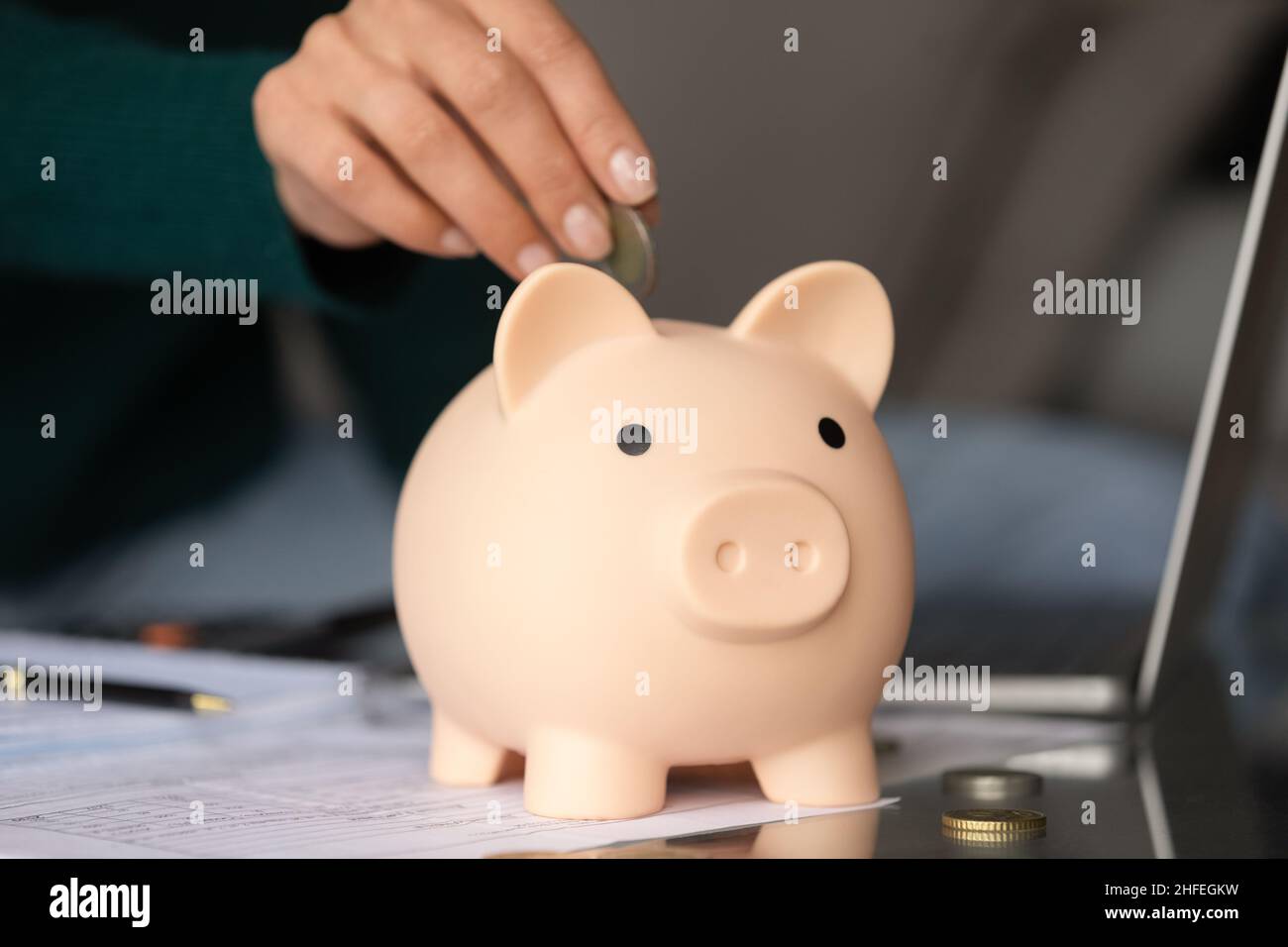 Close up young woman saving money for future Stock Photo - Alamy
