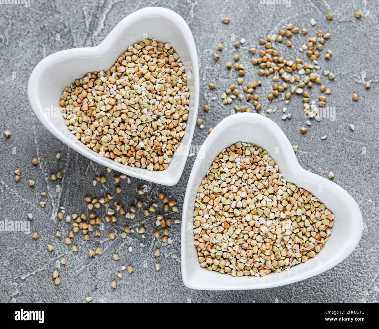 Organic green buckwheat on a grey concrete background Stock Photo - Alamy