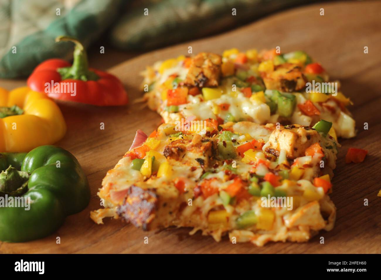 Rectangular slices of home baked pizza loaded with paneer, mozzarella ...