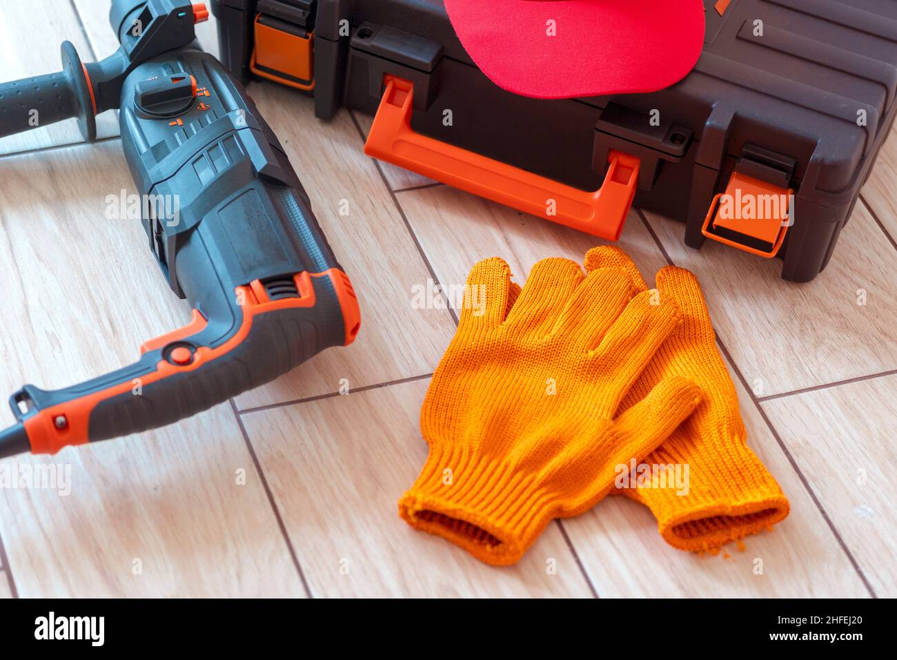 Top view of Working tools.rotary hammer, tool box, work cap, gloves ...