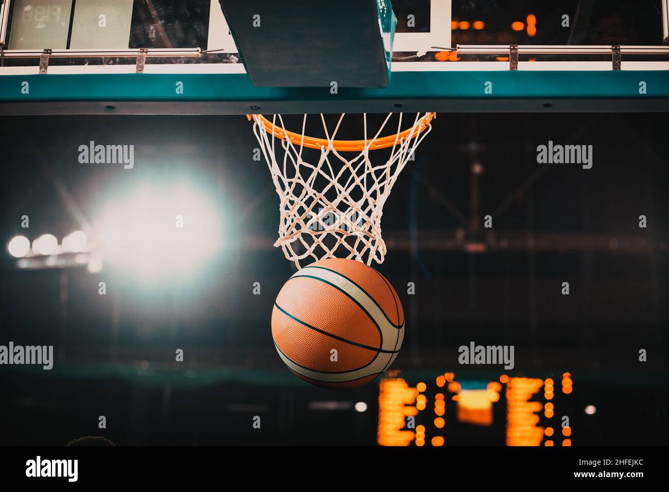 basketball game ball in hoop Stock Photo - Alamy