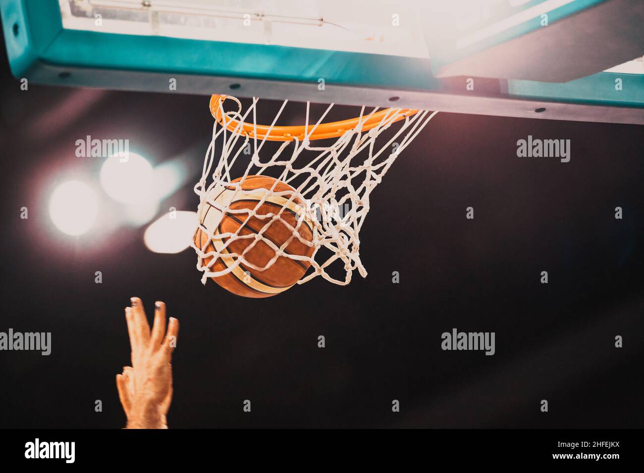 basketball game ball in hoop Stock Photo - Alamy