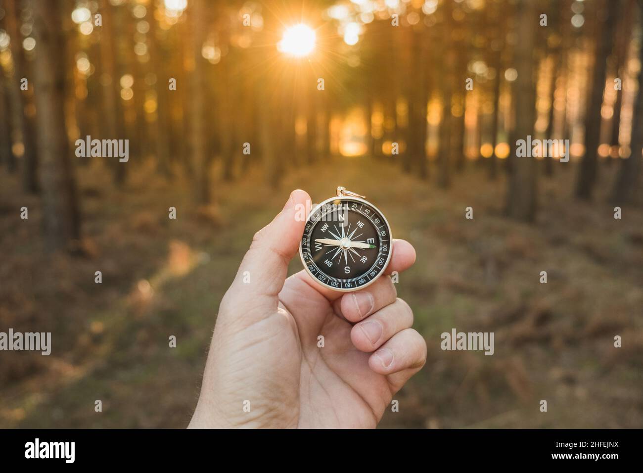 Hand holding a compass hi-res stock photography and images - Alamy