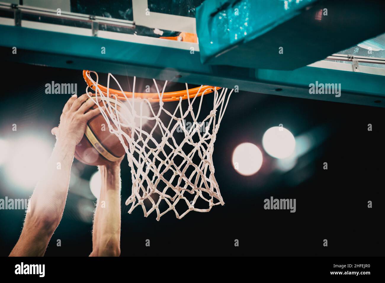 basketball game ball in hoop Stock Photo - Alamy