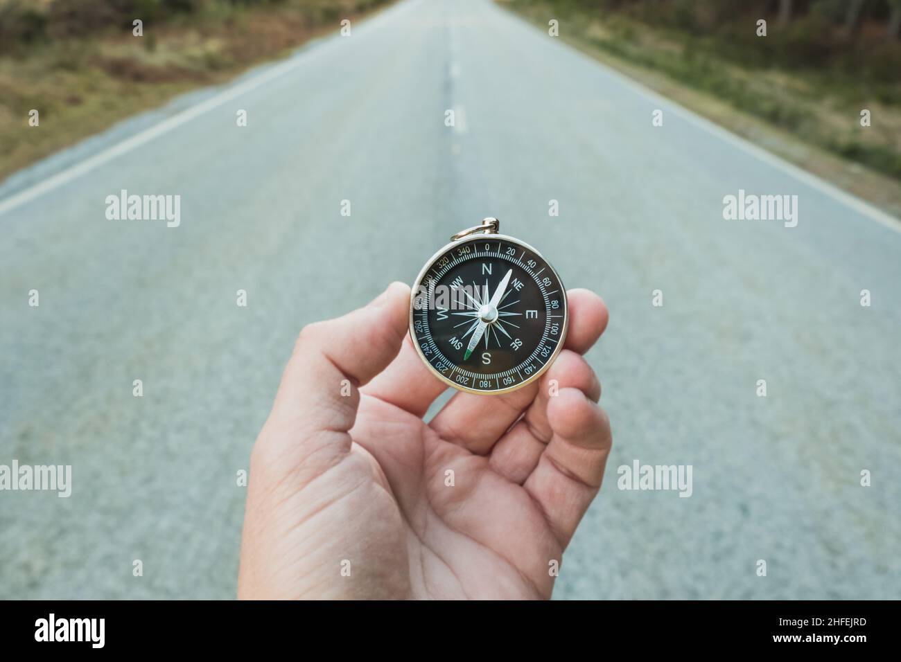 Hand holding a compass hi-res stock photography and images - Alamy