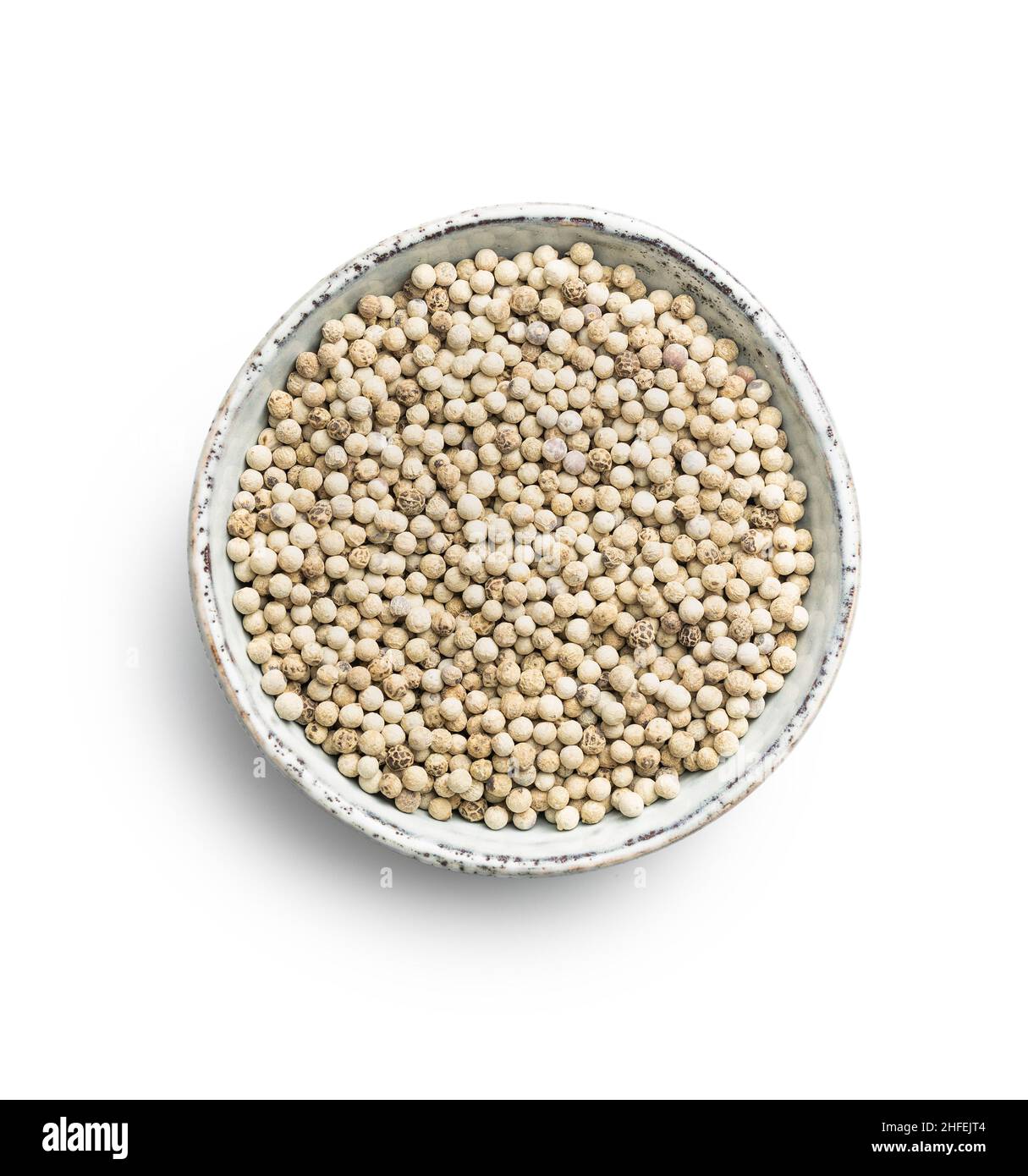 Whole pepper spice. White peppercorn grain in bowl isolated on white ...