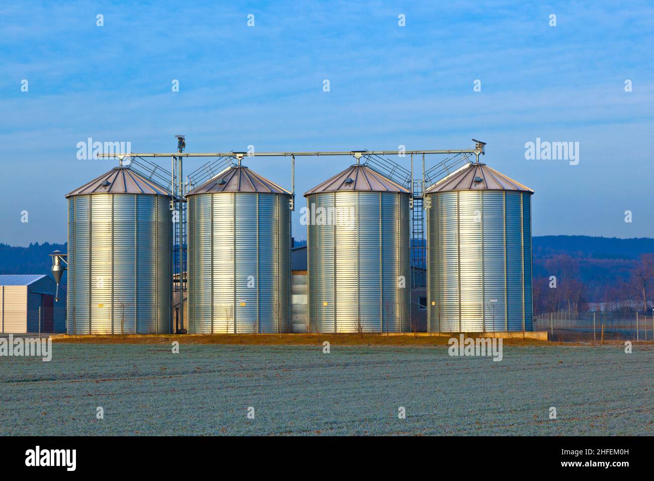 silos in the middle of a field in wintertime Stock Photo - Alamy