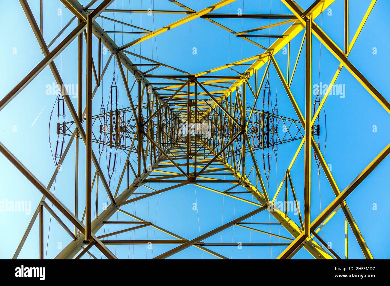 electrical pylon under blue sky, power line cable Stock Photo - Alamy