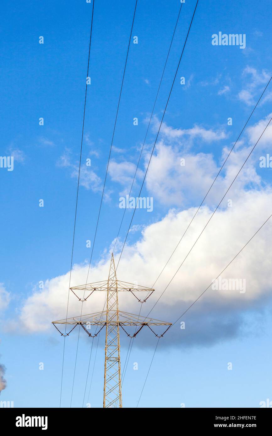 electrical pylon power tower under blue sky Stock Photo - Alamy