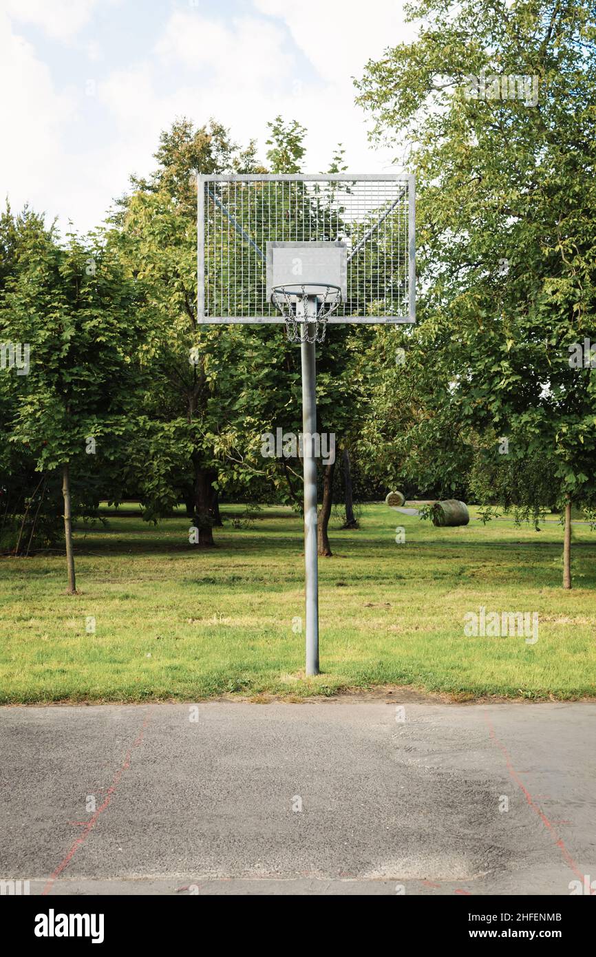 Basketball hoop on the playground in the city park. Basketball court in ...