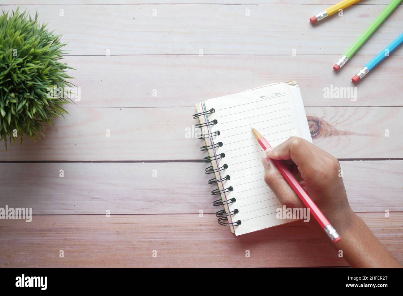 child hand writing on notepad Stock Photo - Alamy