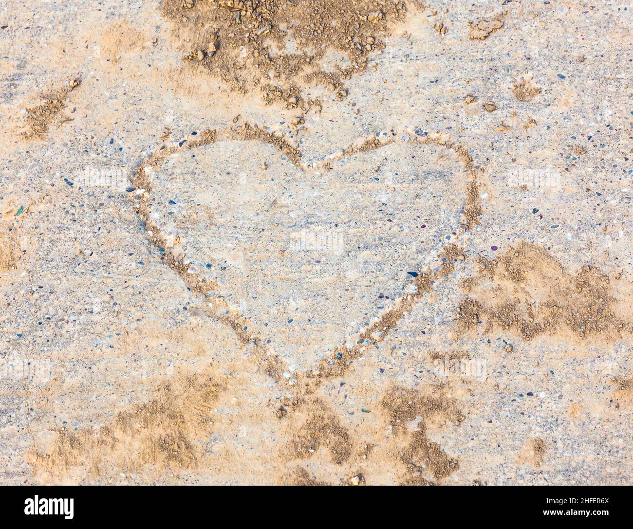 heart shape on a concrete footpath Stock Photo - Alamy