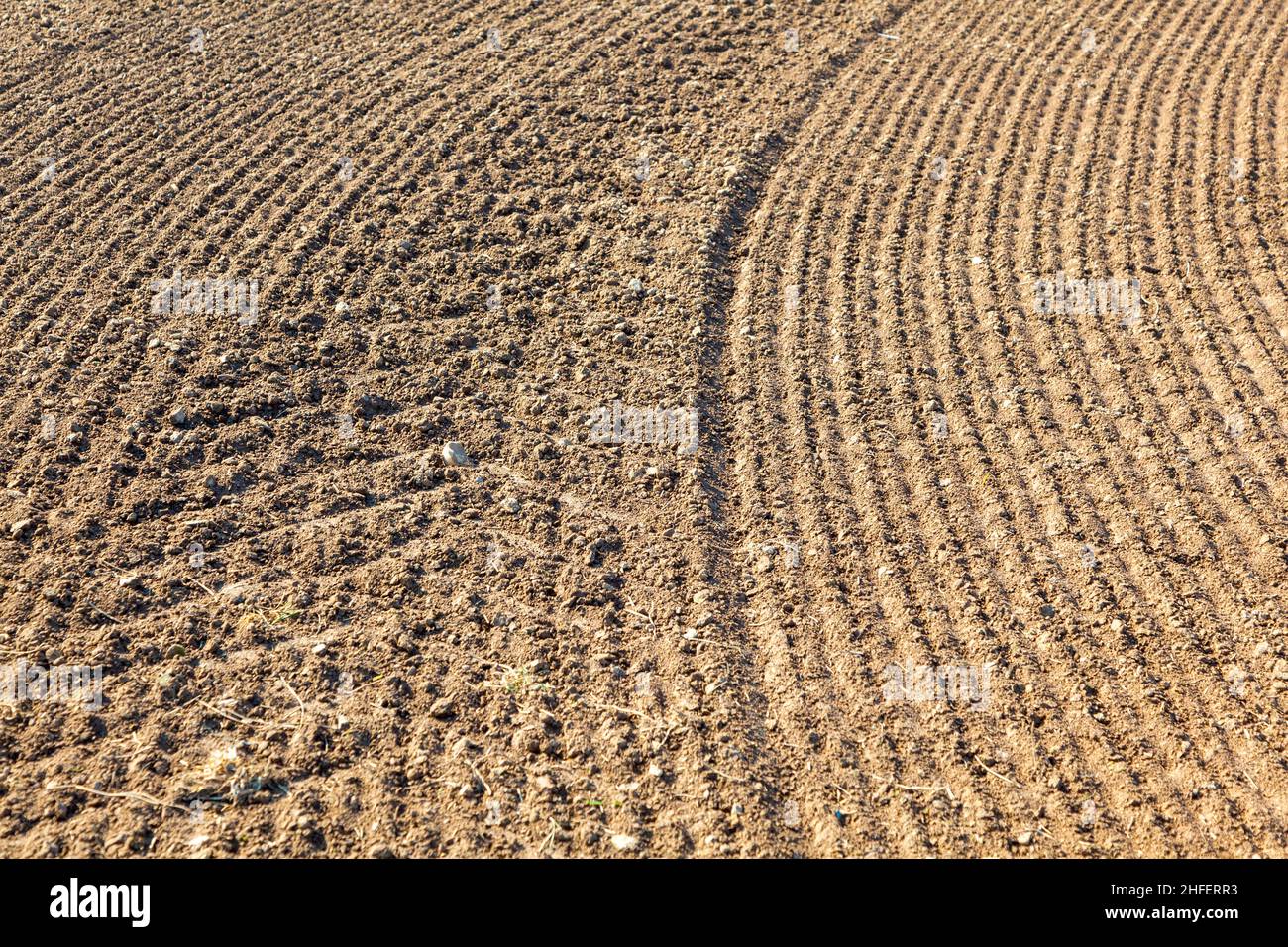 freshly ploughed field in spring before the sead Stock Photo - Alamy