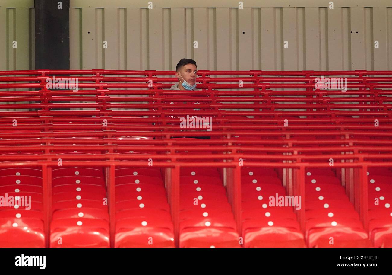 A Liverpool fan sits in the new safe standing section of the stands ...
