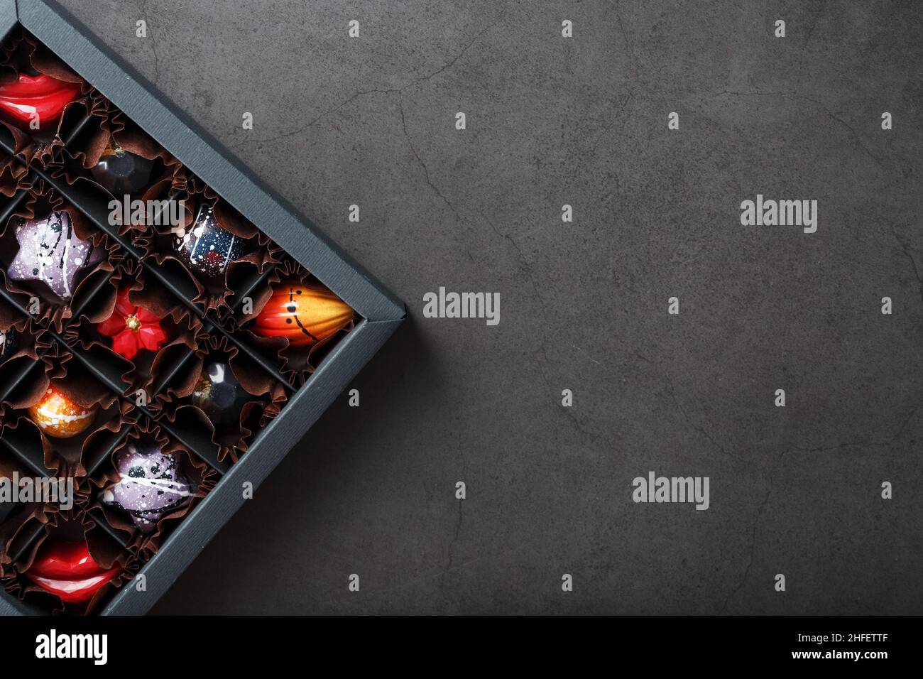 Handmade chocolates in a box. Production of confectionery products ...