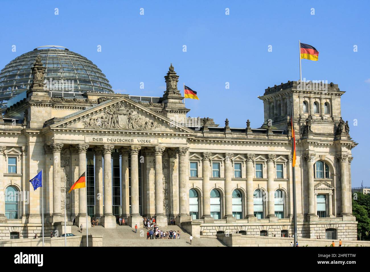 View of front exterior of Reichstag building with glass dome on rooftop ...