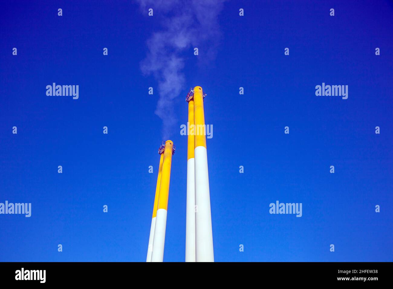 chimney with smoke and blue sky Stock Photo - Alamy