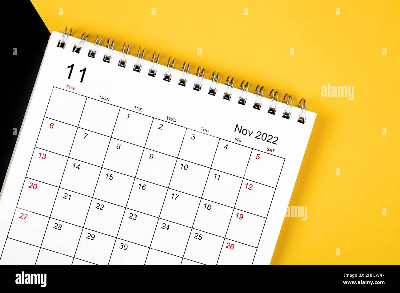 The November 2022 desk calendar on yellow and black background Stock ...