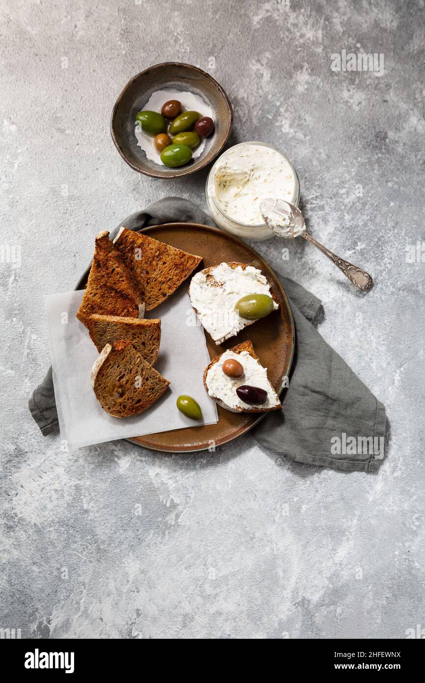 Toasted rye bread and cream cheese bruschetta overhead view Stock Photo ...