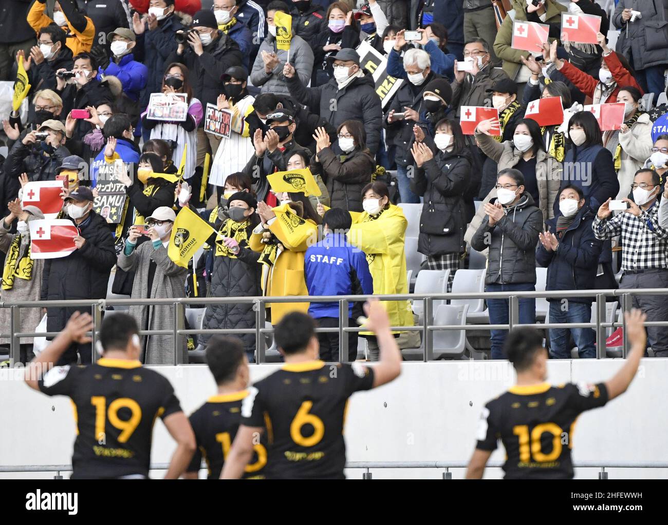 Spectators show flags of Tonga in support of the underwater volcanic ...